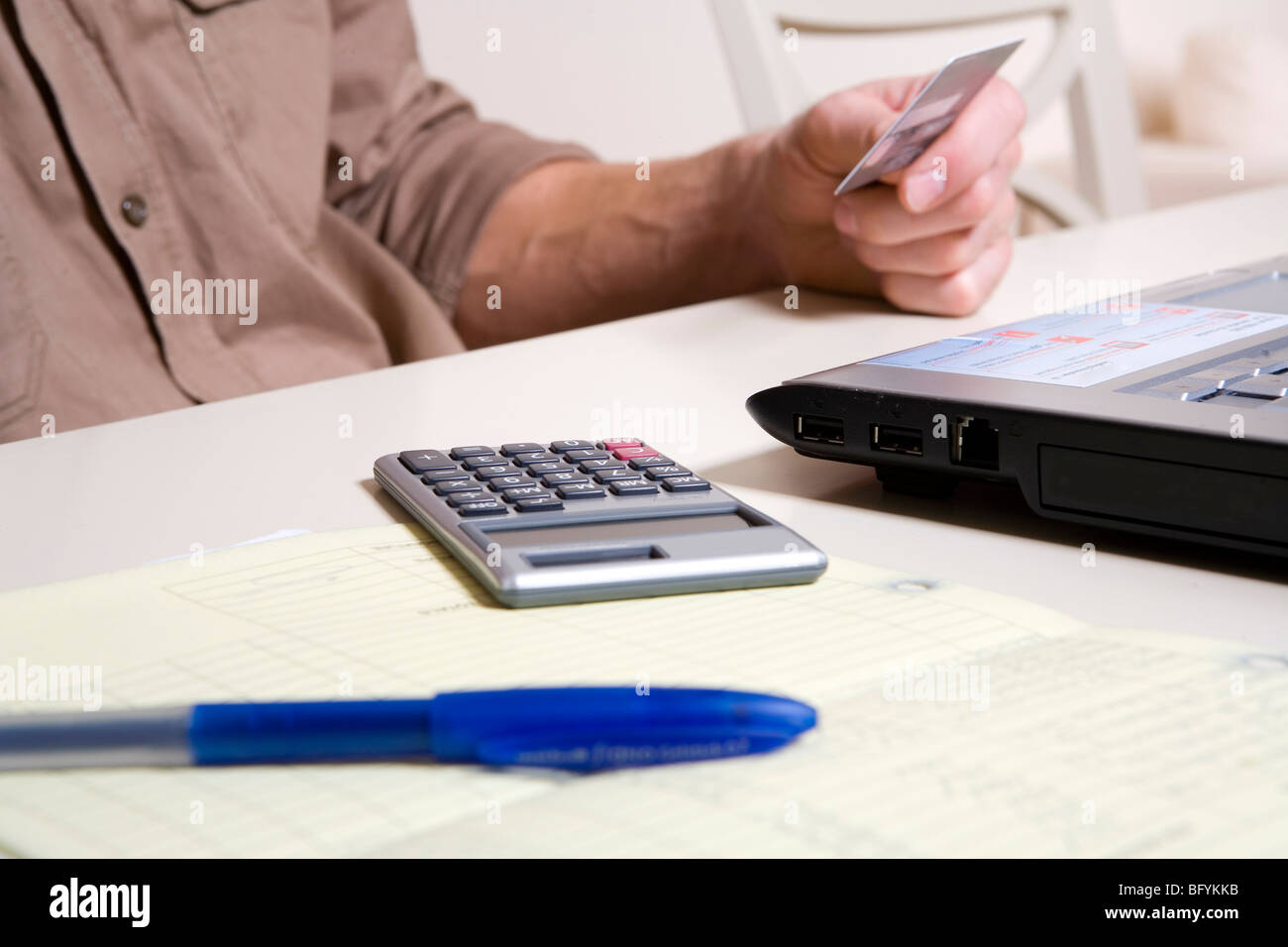Man paying bills online Stock Photo - Alamy