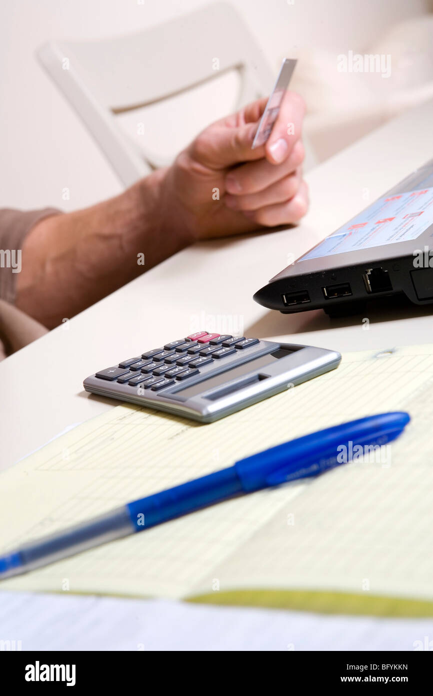 Man paying bills online Stock Photo - Alamy