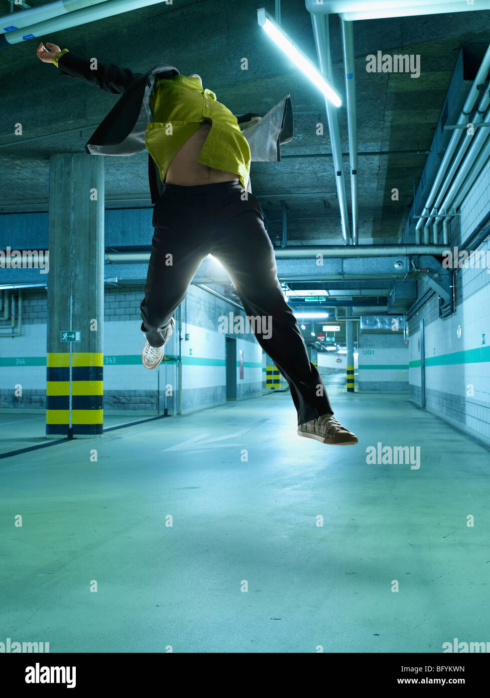 Man dancing in an urban car park Stock Photo - Alamy
