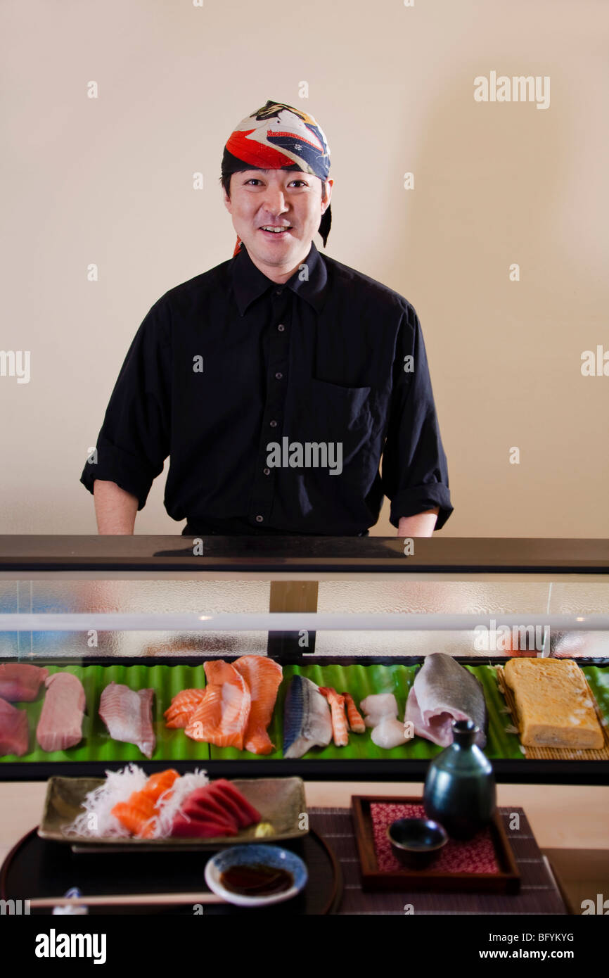 portrait of japanese chef presenting sushi in restaurant Stock Photo ...