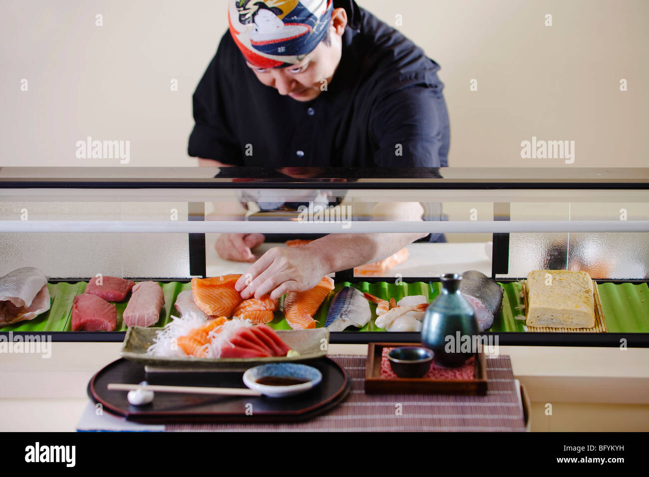 portrait of japanese chef in arranging sushi in restaurant Stock Photo ...