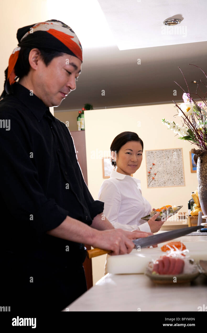 Japanese woman cook fish hi-res stock photography and images - Alamy