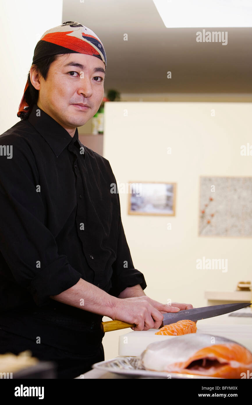 portrait of japanese chef preparing sushi Stock Photo - Alamy