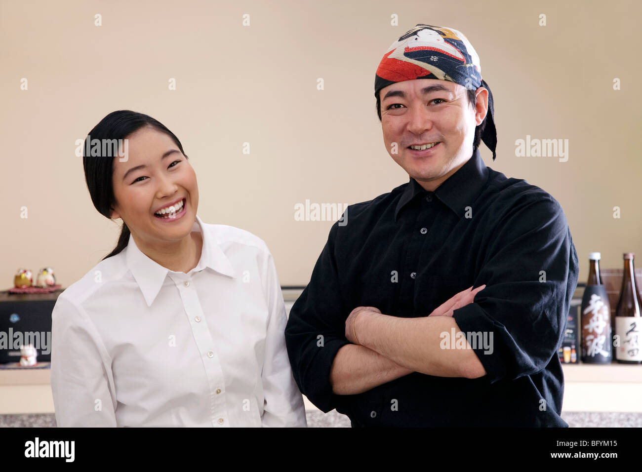 portrait of japanese waitress and chef in restaurant Stock Photo - Alamy