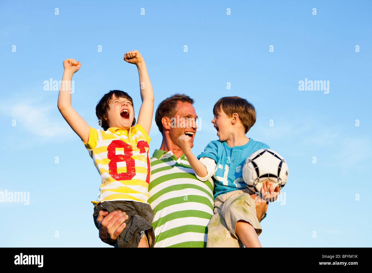 Father And Sons Proud Winners Stock Photo - Alamy