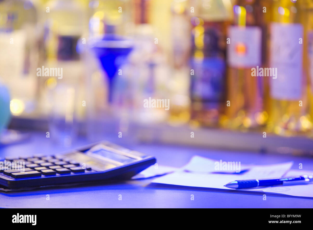 calculator and notes on table in bar Stock Photo - Alamy