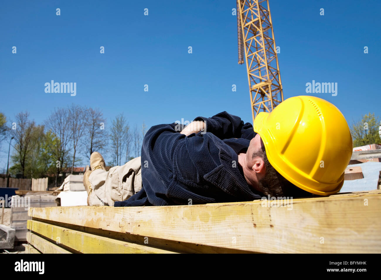 construction worker taking a nap on construction site Stock Photo - Alamy