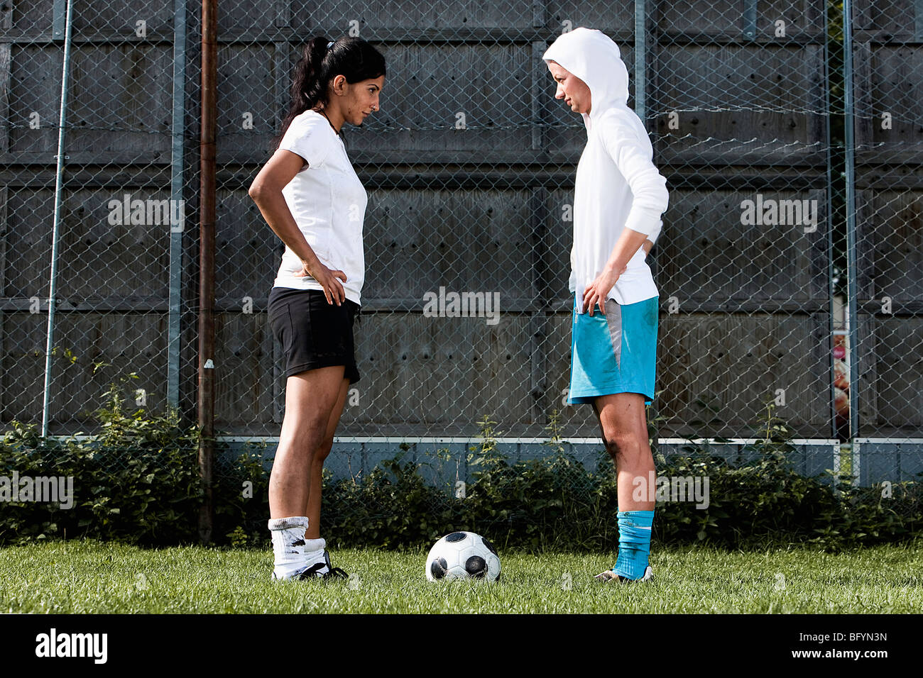 Portrait two football players standing hi-res stock photography and ...