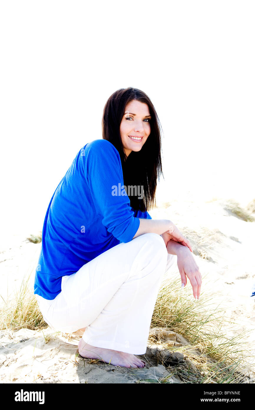 Mid adult woman on the beach Stock Photo - Alamy