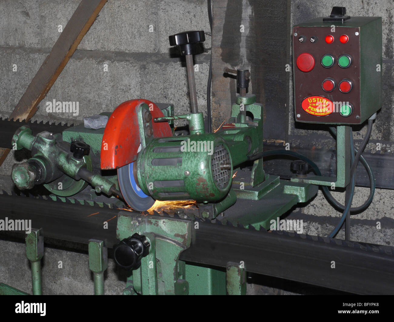Turkey, Metal work shop, a grinding machine sharpens a lumberjack's saw ...