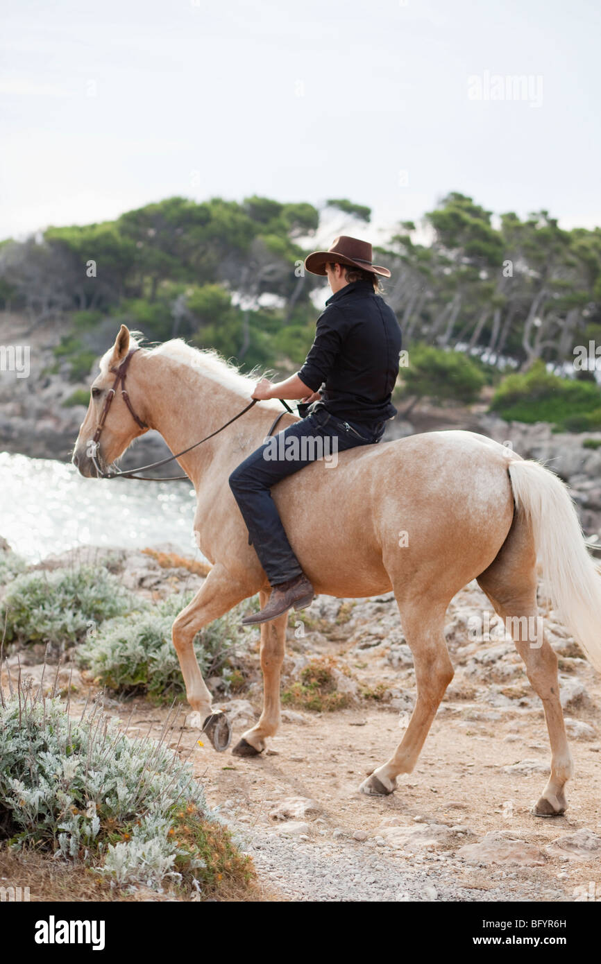 man riding horse Stock Photo - Alamy