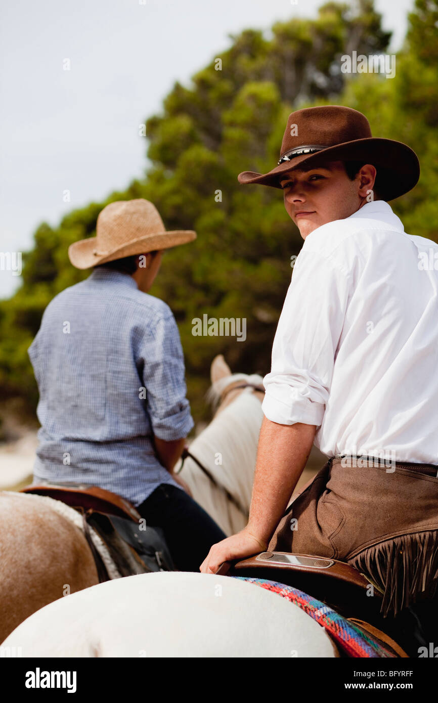 Two men horseback riding hi-res stock photography and images - Alamy