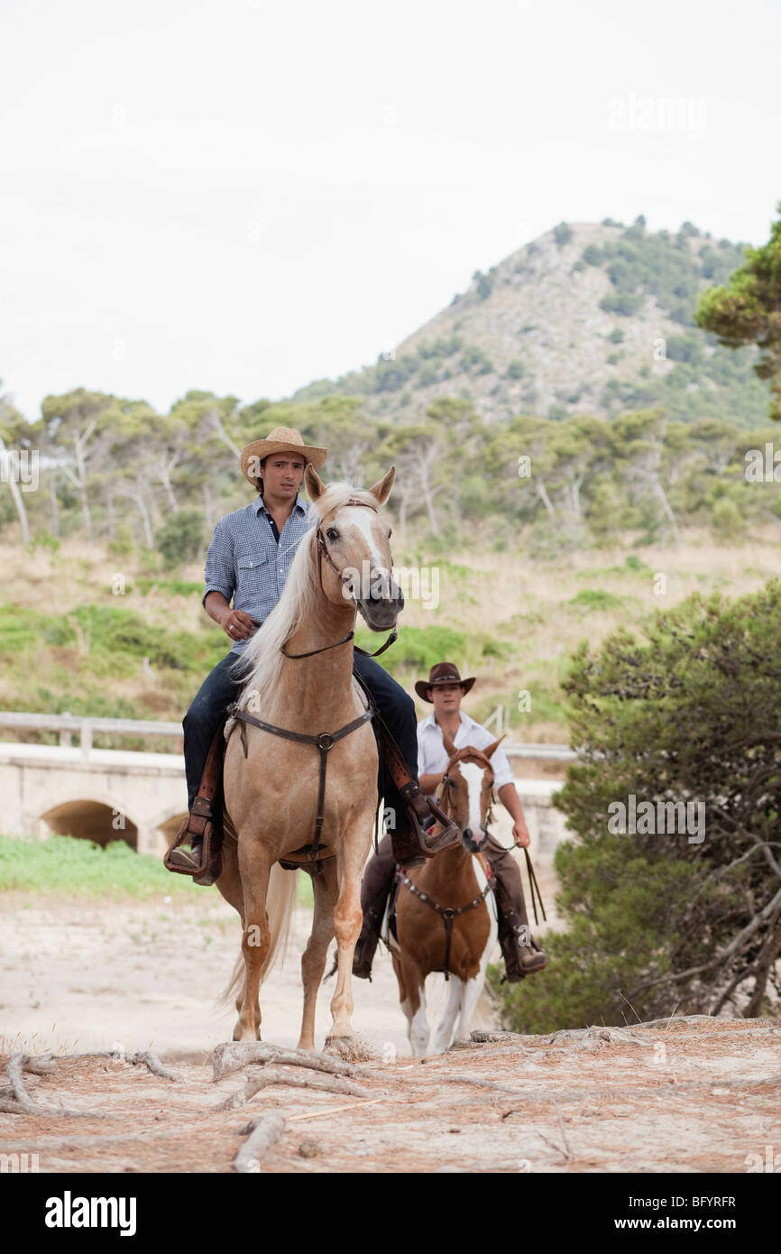Two men horseback riding hi-res stock photography and images - Alamy