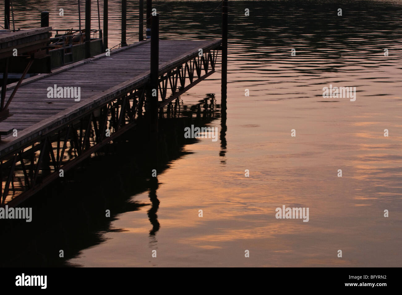 Pier and its reflection on the Ottawa River in Point Place, Toledo ...