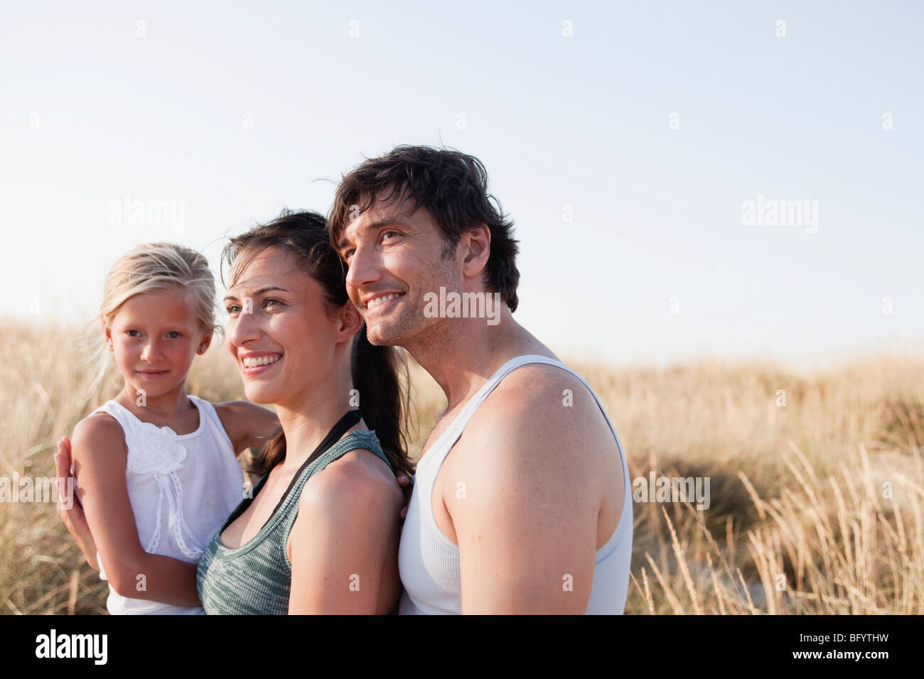 family smiling at the beach Stock Photo - Alamy