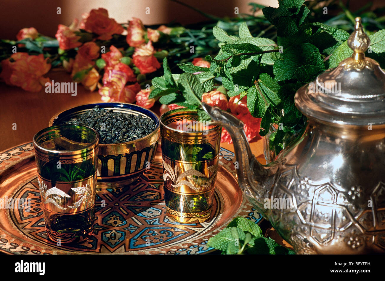 Morocco, a detail of an ornate tray and silver teapot, two decorative ...