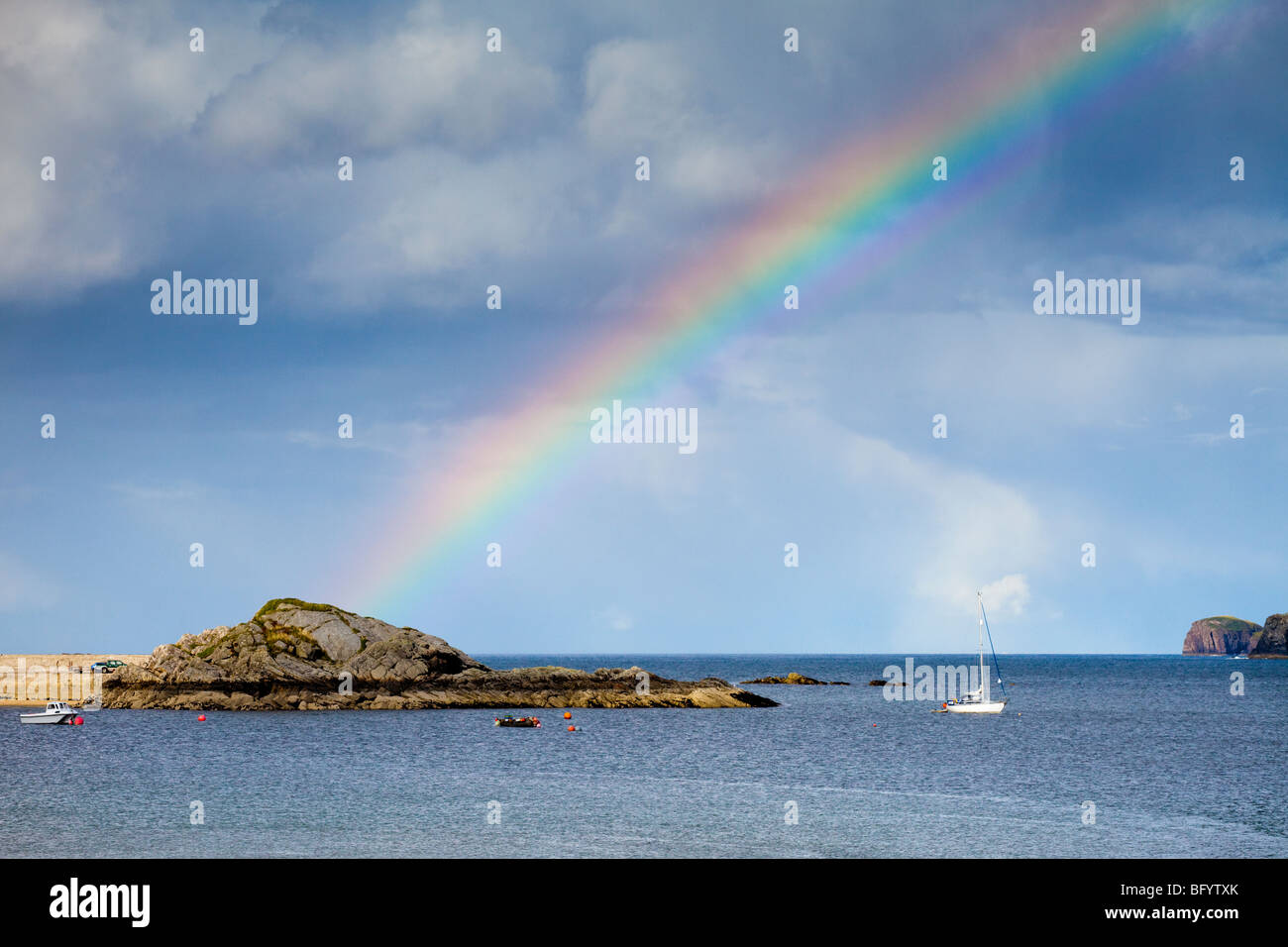 A rainbow over the sea at Talmine, Highland, Scotland Stock Photo - Alamy