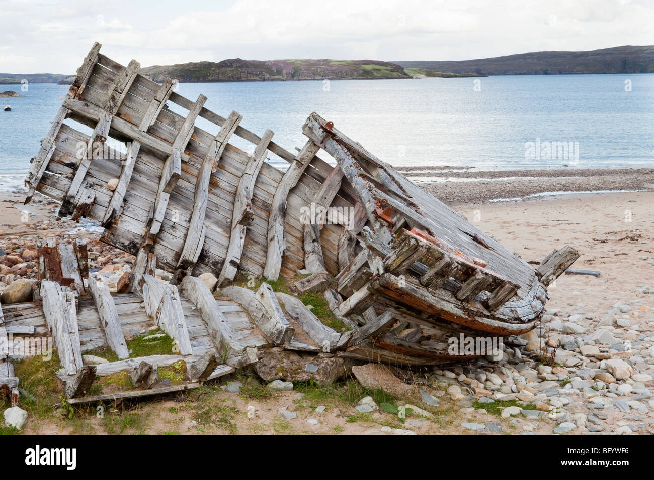 The remains of a ruined fishing boat on the beach at Talmine, Highland ...