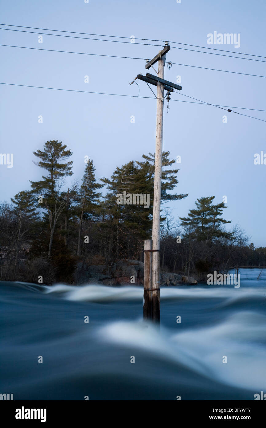 Electricity pole submerged by flood Stock Photo - Alamy
