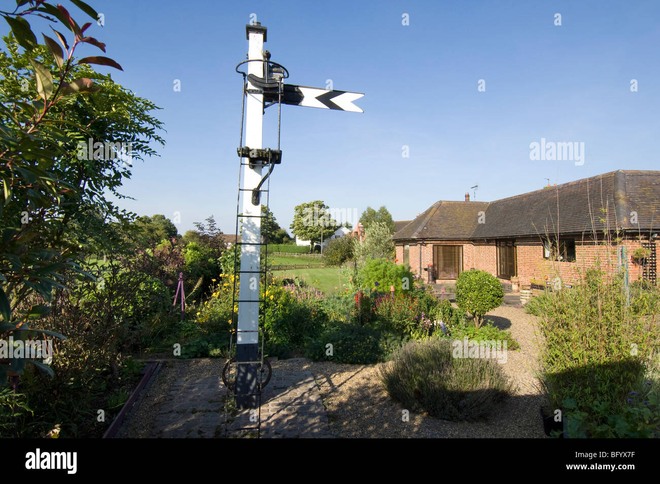 A preserved railway signal in a rail enthusiast's garden, part of a ...