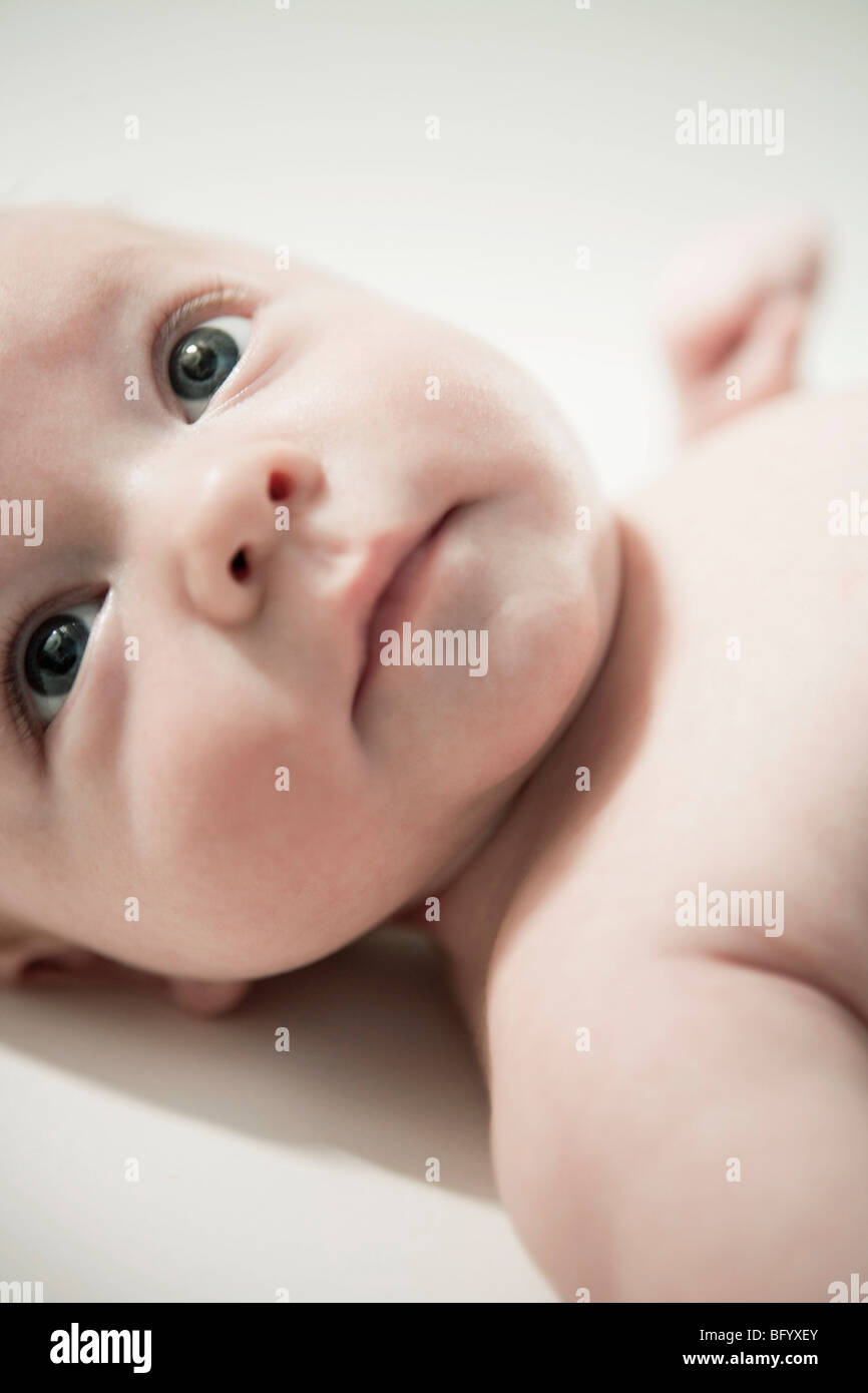 Young baby laying down Stock Photo - Alamy