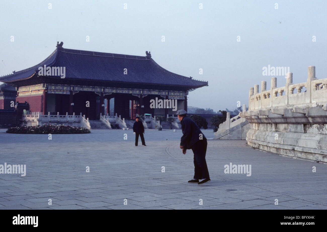 Two men play early morning Frisbee at the Temple of Heaven in Beijing ...