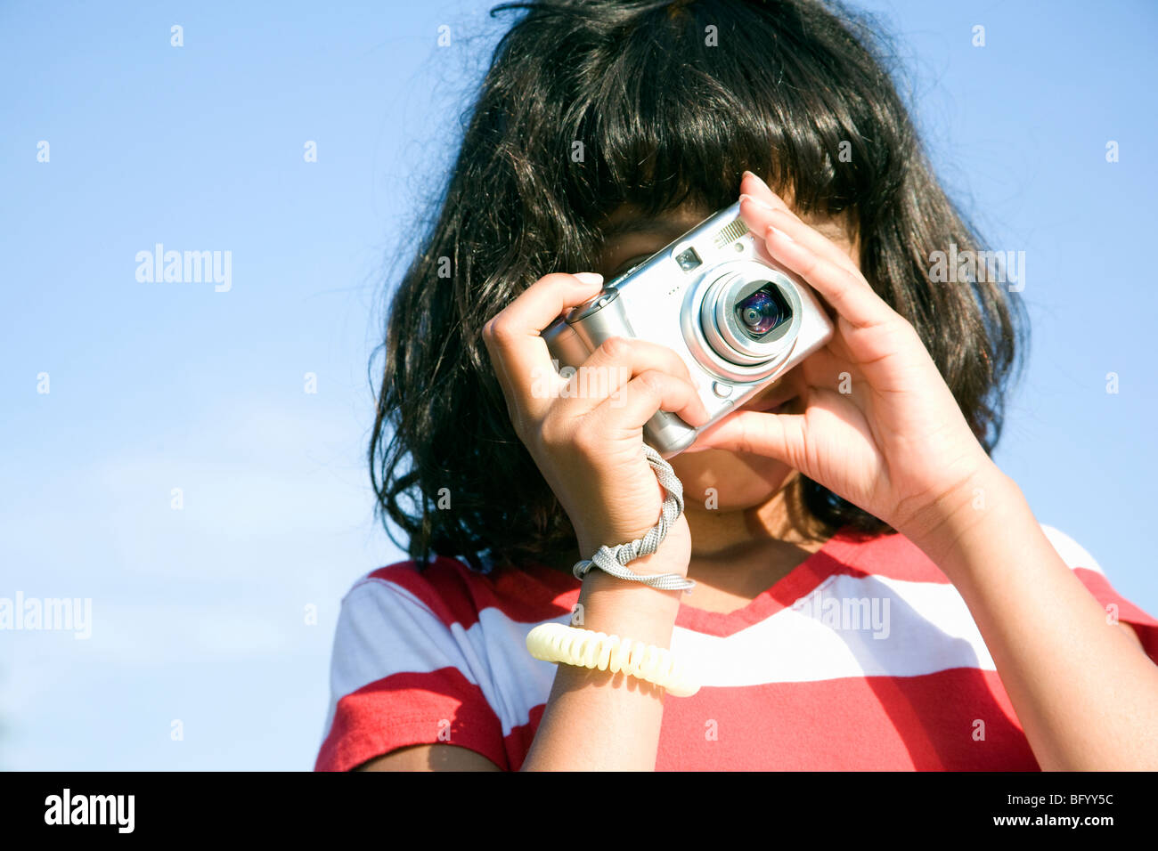 Girl taking picture with digital camera Stock Photo - Alamy