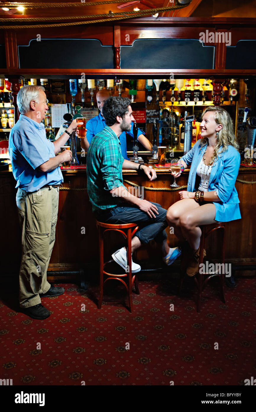 People drinking in a pub Stock Photo - Alamy