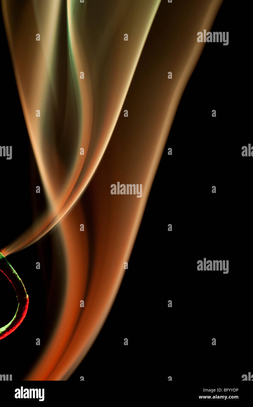 Colored Smoke, different forms figures and colors on black background ...