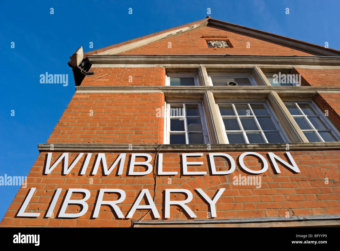 exterior of wimbledon library with name in upper case lettering, in ...