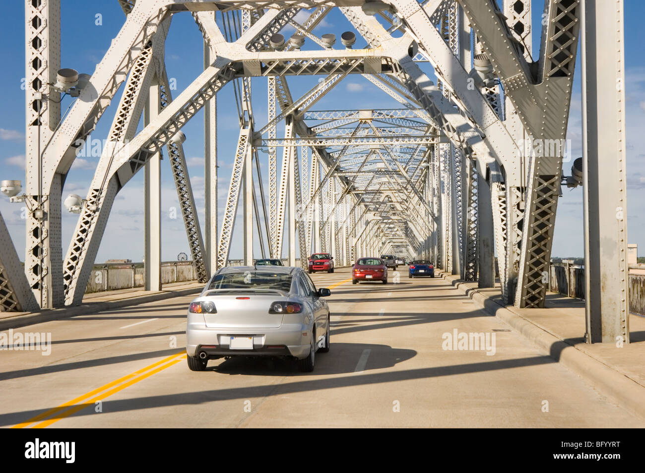Bridge carrying commuter traffic crossing an interstate highway four ...