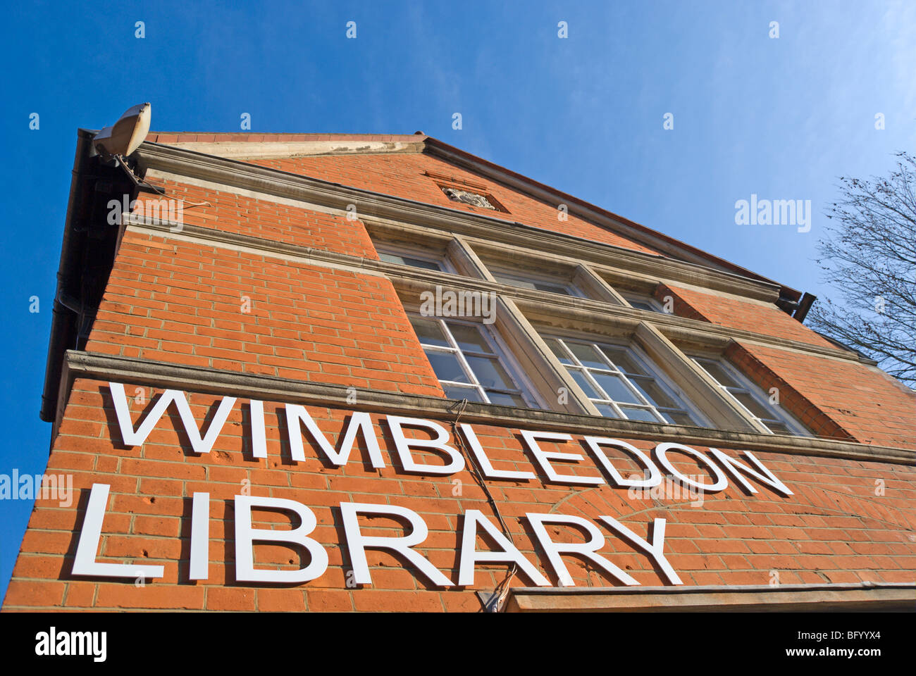 exterior of wimbledon library with name in upper case lettering, in ...