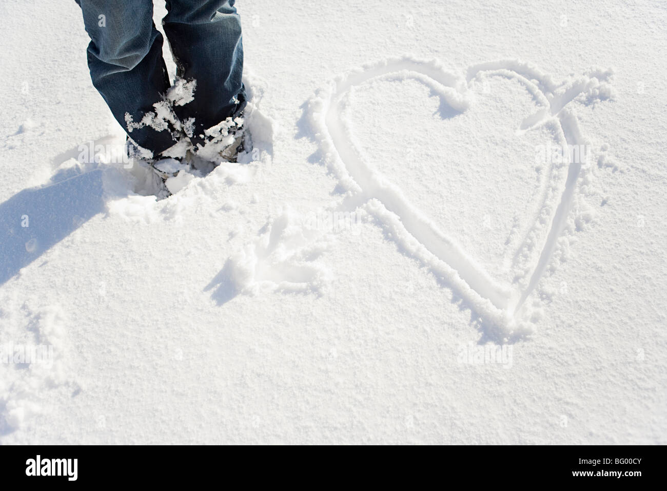 Drawing of a heart in the snow Stock Photo - Alamy