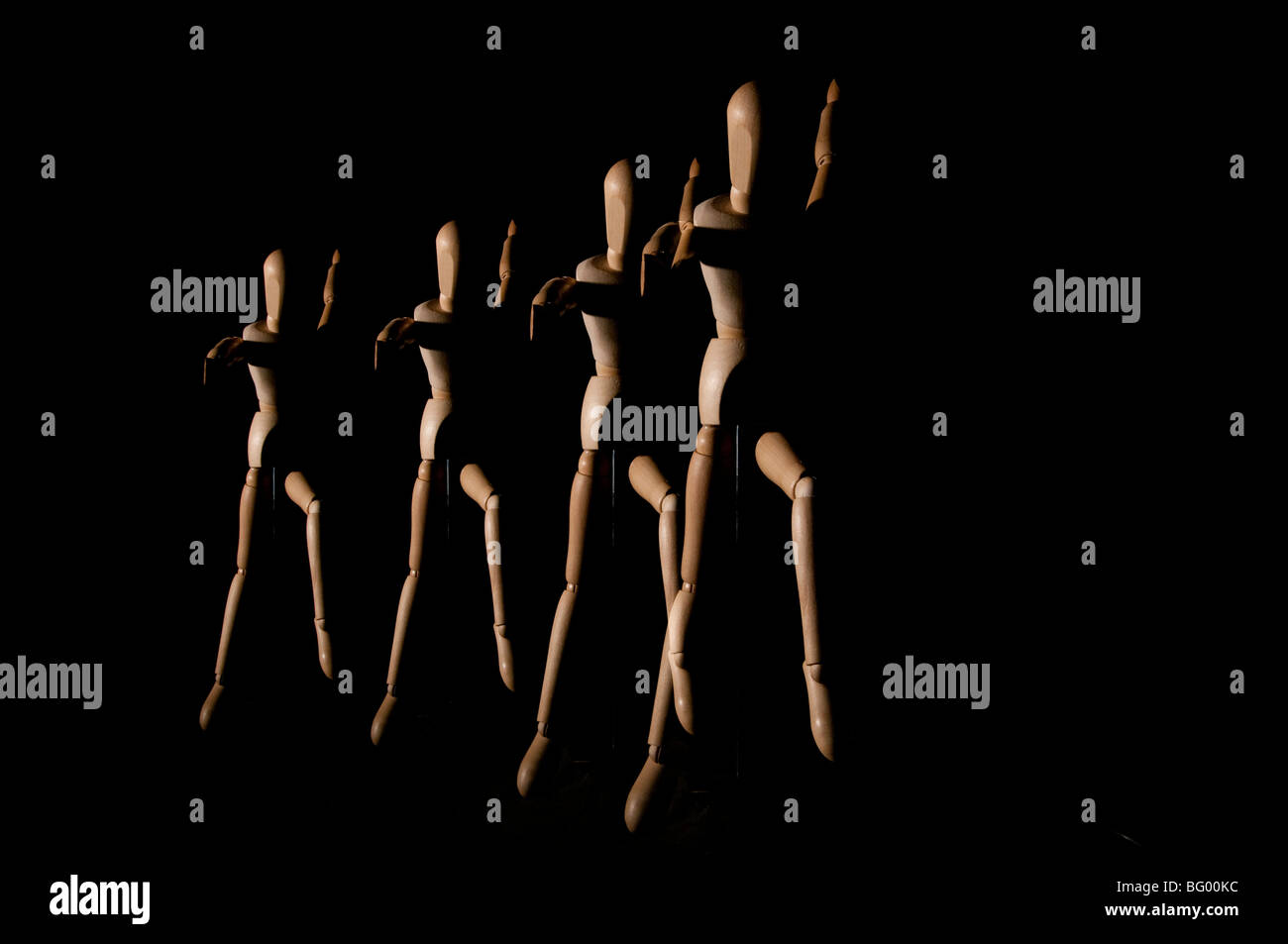 Wooden figure, multiple exposure to simulate movement Stock Photo - Alamy