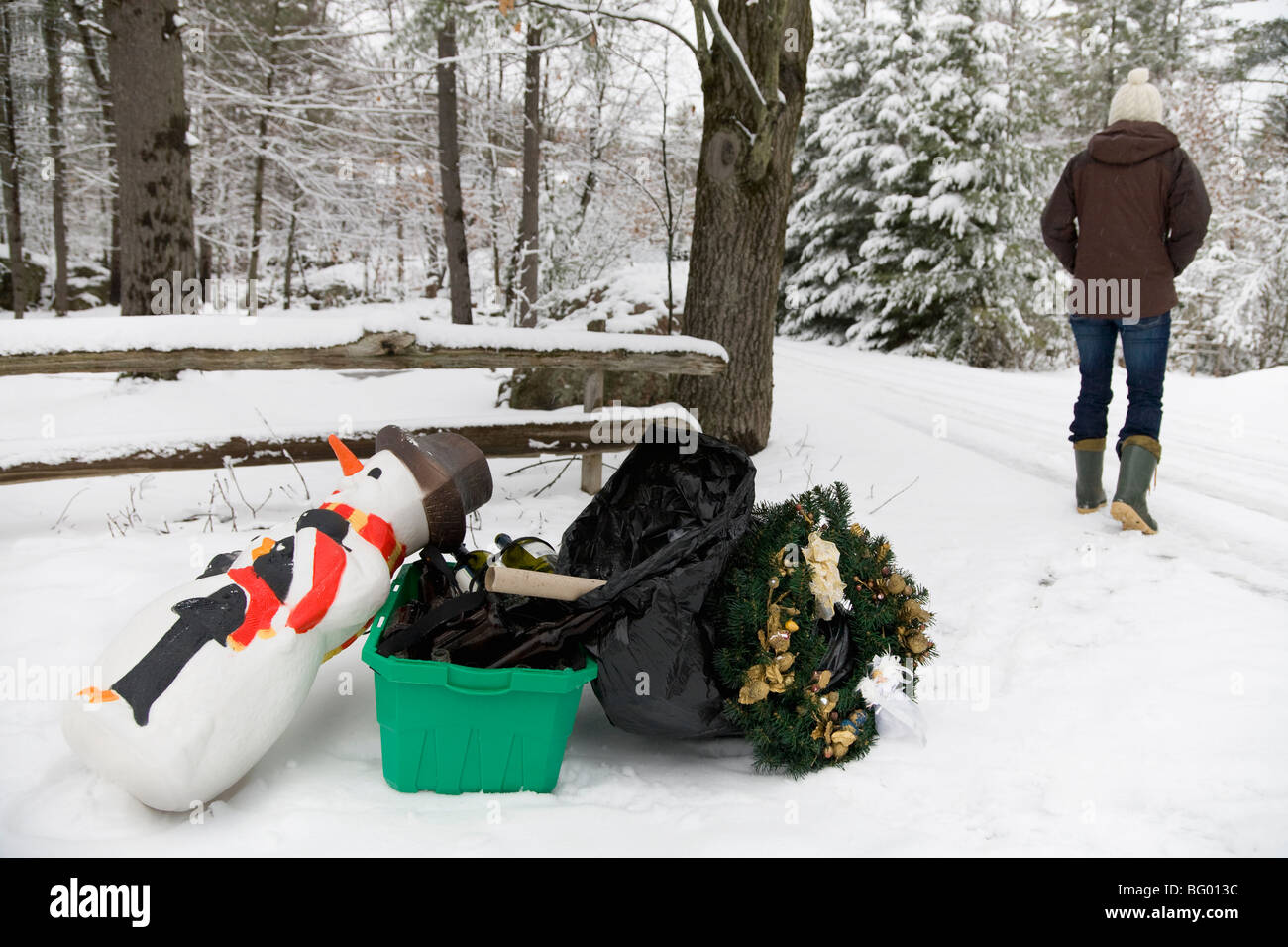 Woman disposing of festive decorations Stock Photo - Alamy