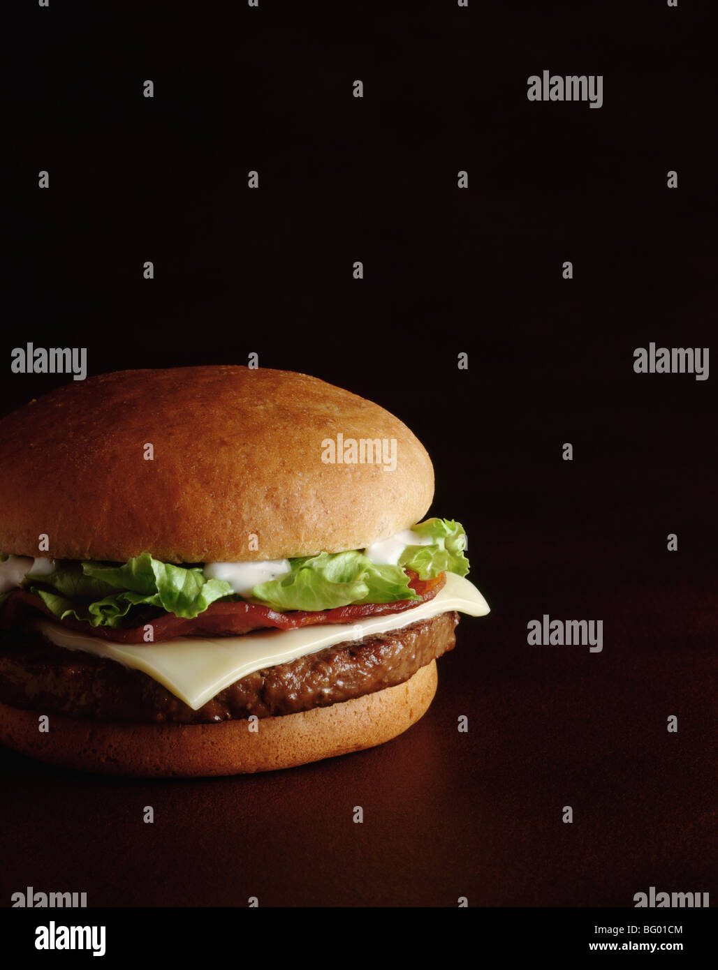 Bacon cheese hamburger with mayonnaise Stock Photo - Alamy