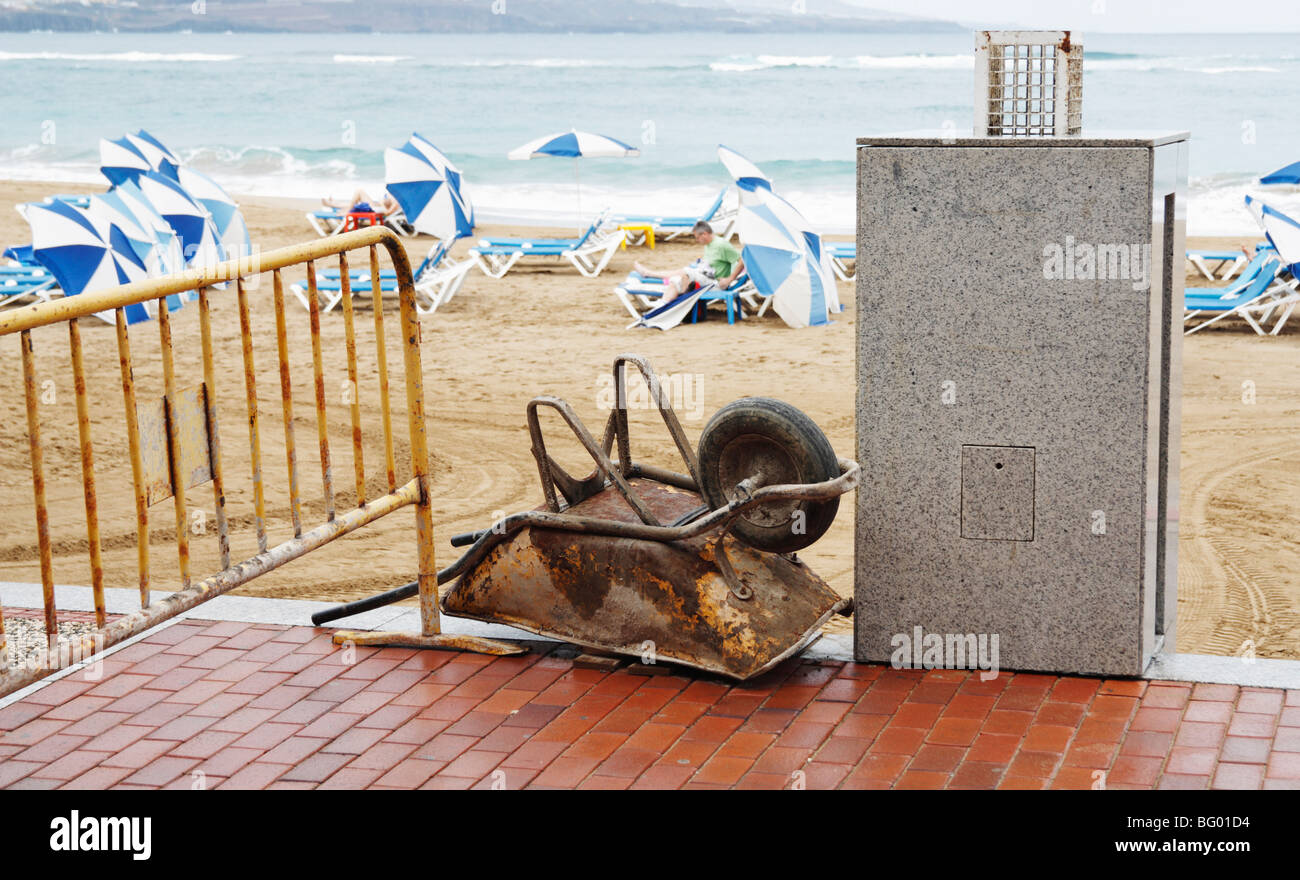 Wheelbarrow in front of hotel on beach in Spain Stock Photo - Alamy