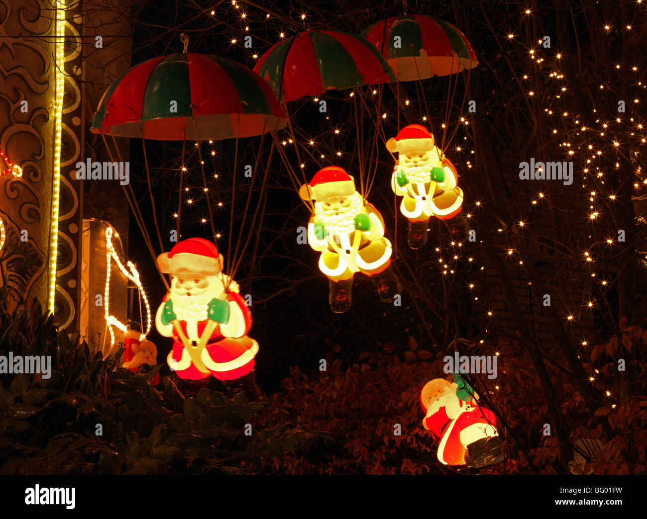 The colourful lights of a decorated Christmas house with Santa Claus ...