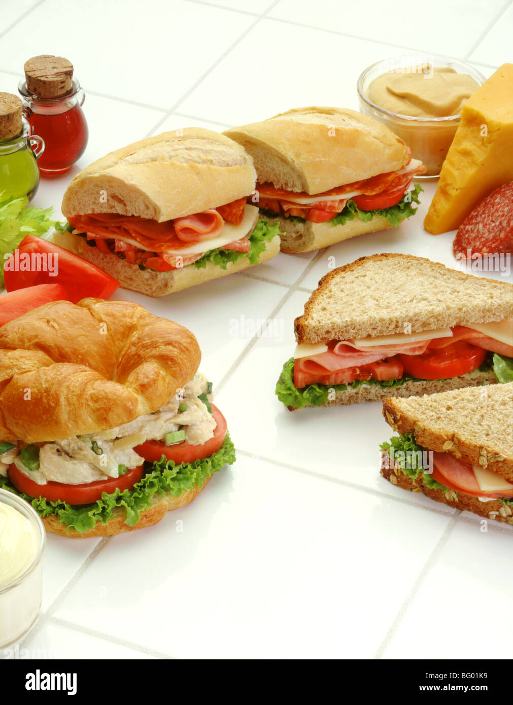 Assorted deli sandwiches on white tile Stock Photo - Alamy