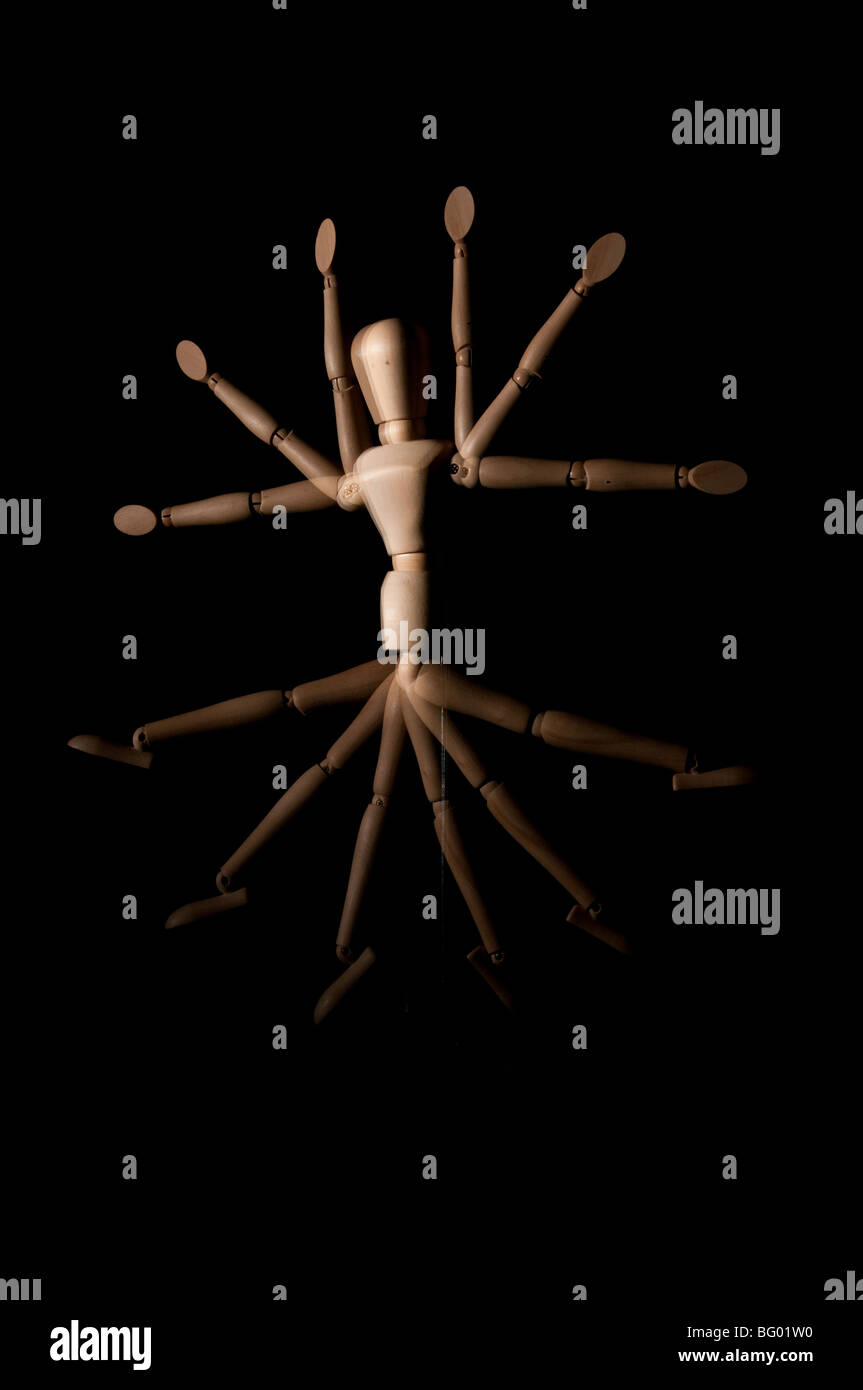 Wooden figure, multiple exposure to simulate movement Stock Photo - Alamy