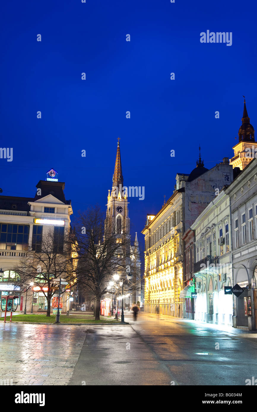 Novi Sad street at night, look on cathedral and town square Stock Photo ...