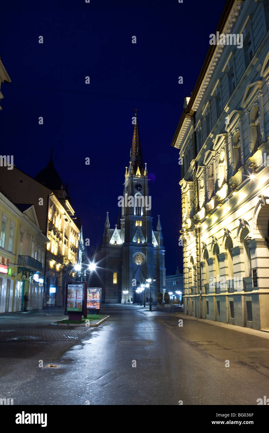 Novi Sad street at night, look on cathedral and town square Stock Photo ...