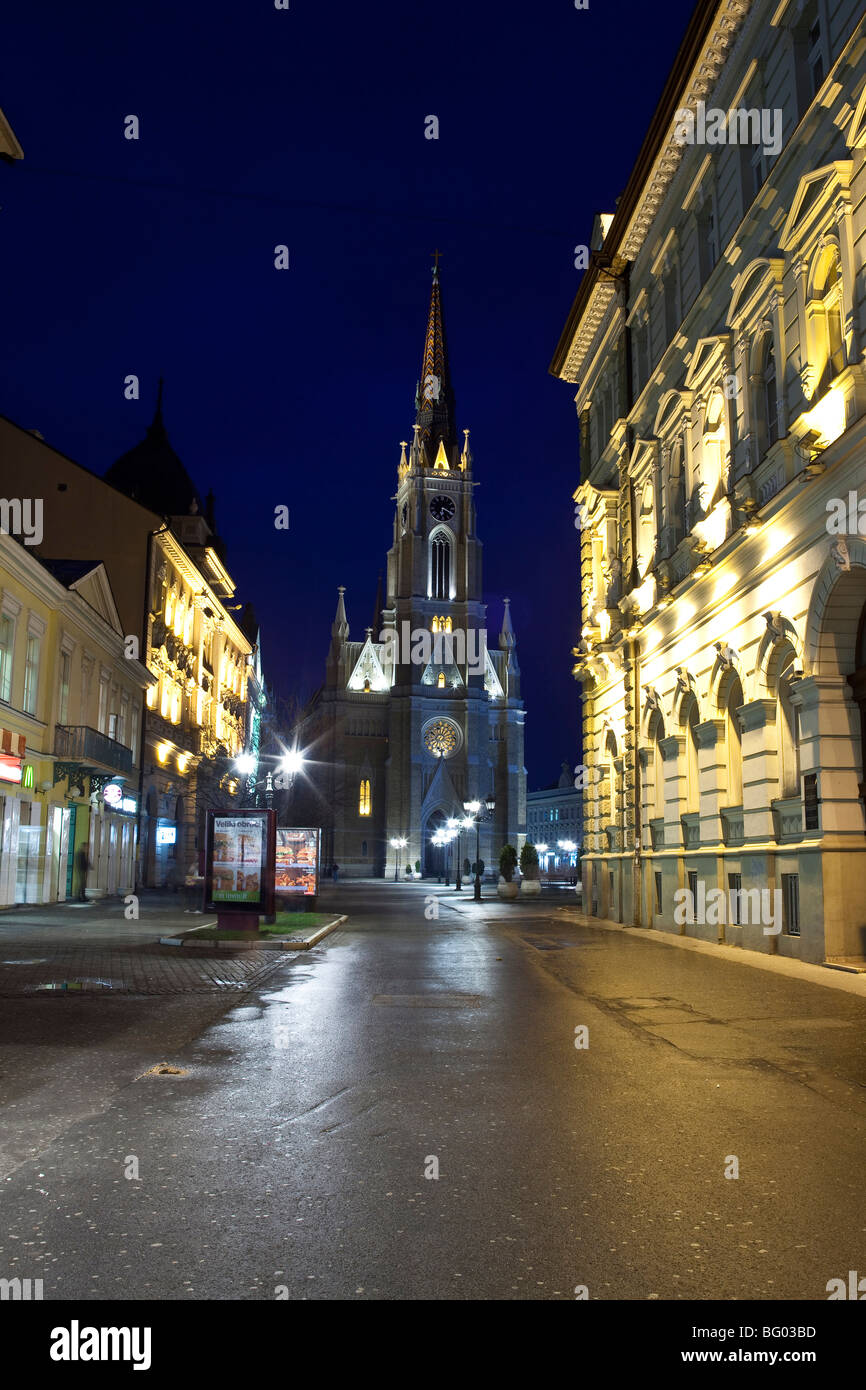 Novi Sad street at night, look on cathedral and town square Stock Photo ...