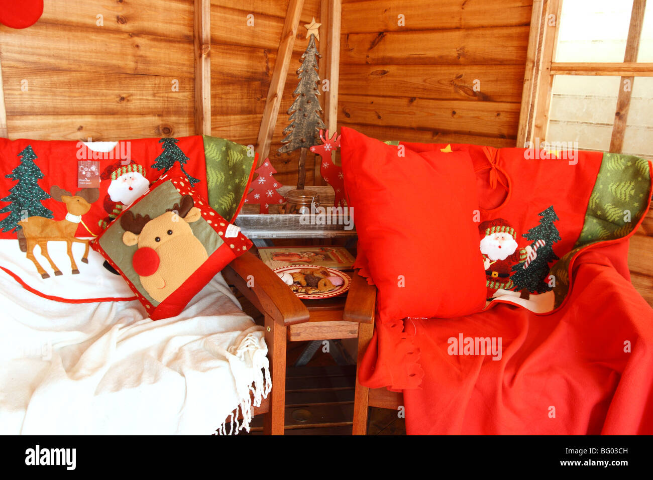 Santa's Grotto table and chairs stocking etc Stock Photo - Alamy
