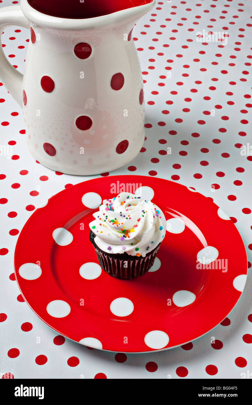 Cupcake and pitcher with dots Stock Photo - Alamy