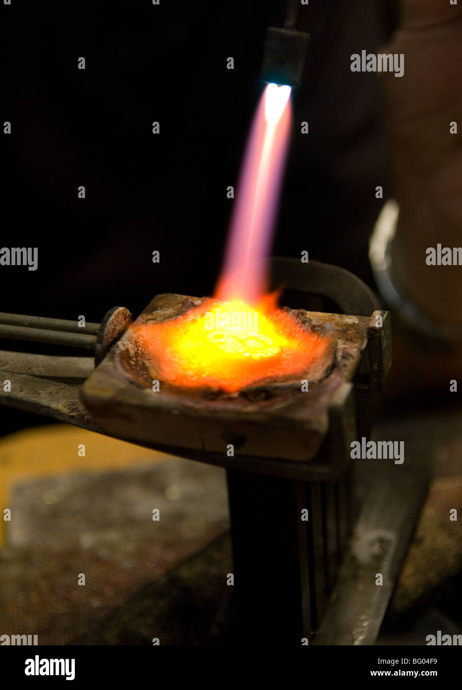 Melting gold at a jewellers workshop Stock Photo - Alamy