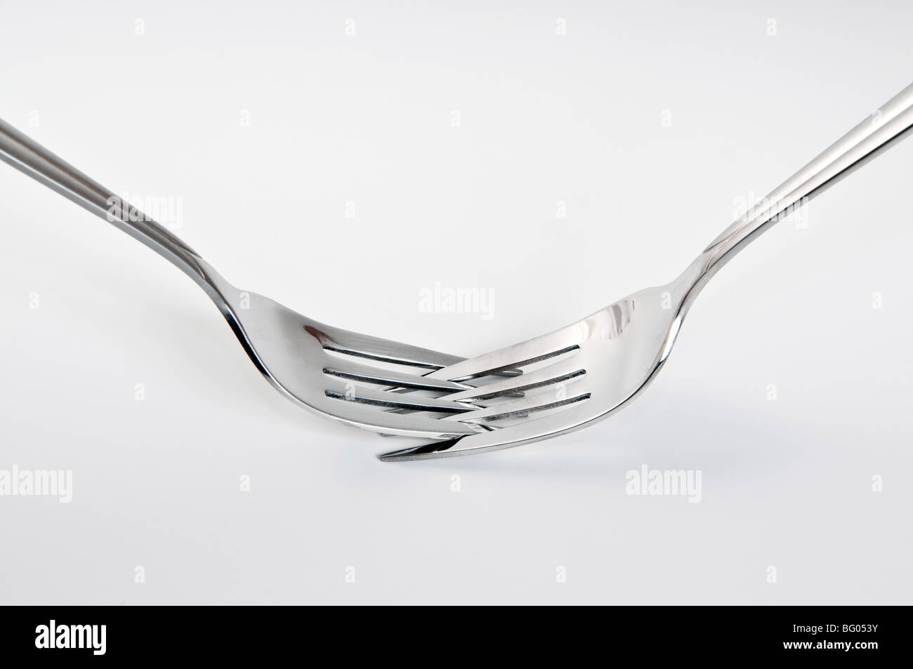 Two fork on white background Stock Photo - Alamy