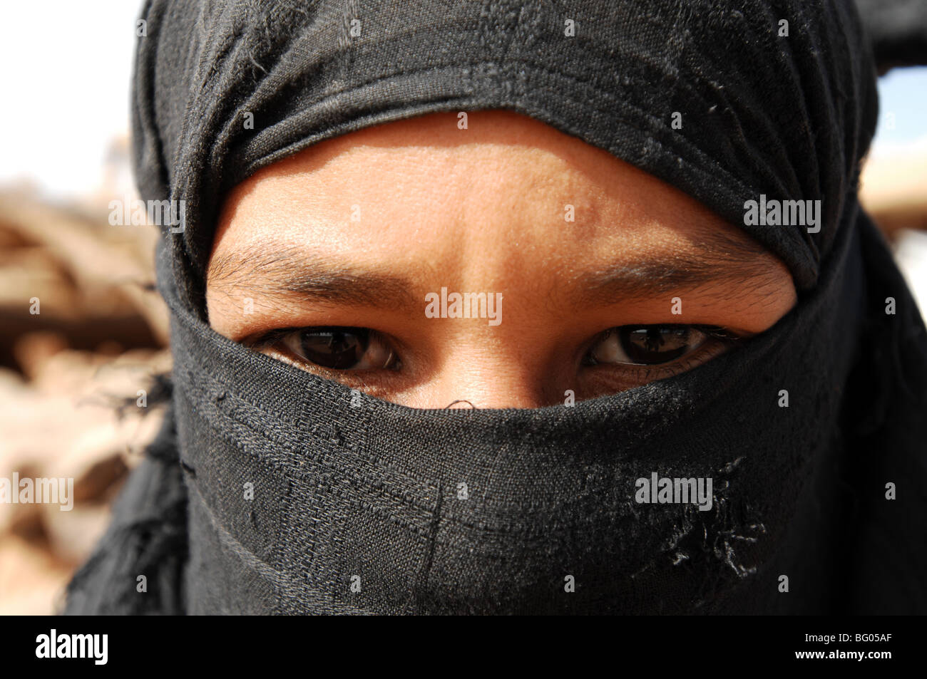 A berber girl in Sahara Desert with mask in the south of Morocco Stock ...