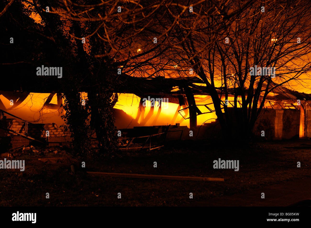 Factory Warehouse on fire at night Stock Photo - Alamy