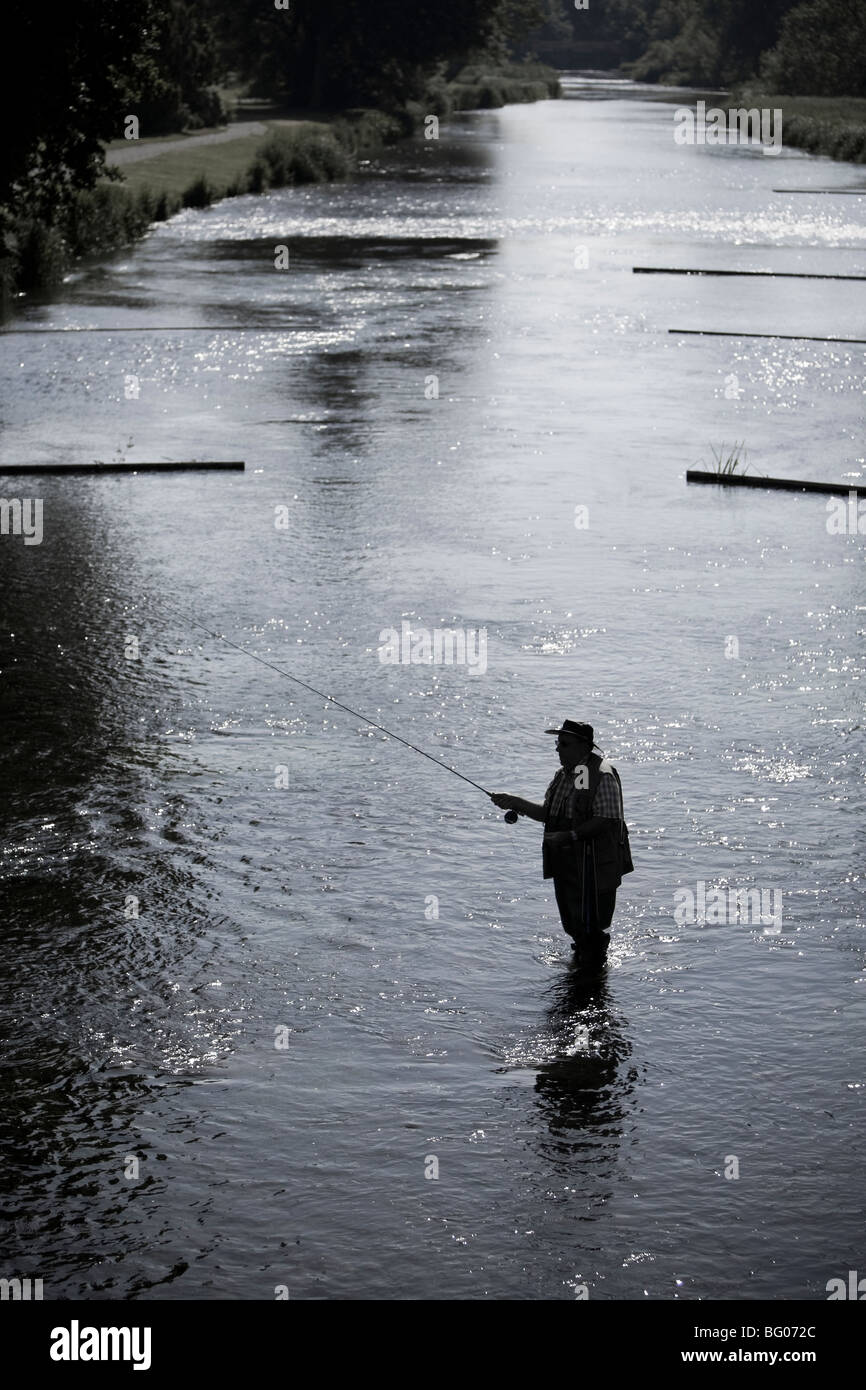 Fly fisherman in trout stream Stock Photo - Alamy